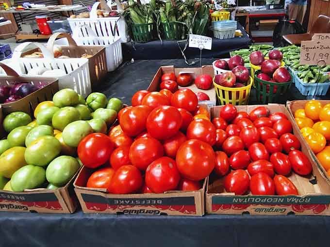 Farm-fresh produce brings color and nutrition to the market, proving flea markets serve practical needs alongside treasure hunting.