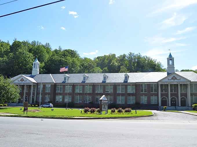 The former high school building stands stately and proud, its columns speaking to an era when communities invested in education and architecture.