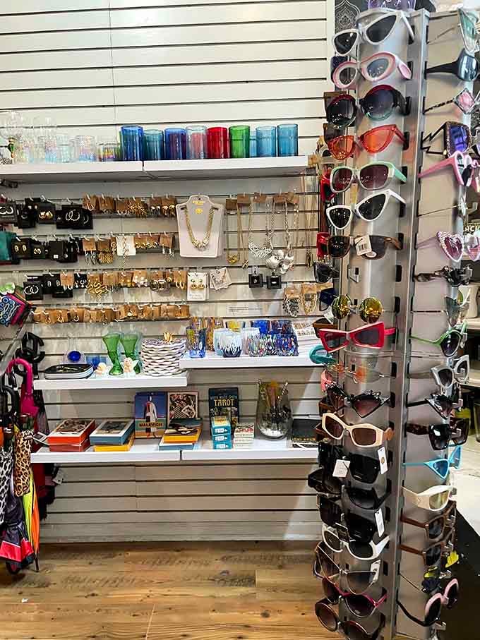 Sunglasses and treasures displayed like a quirky museum exhibit celebrating decades of questionable but lovable fashion choices.