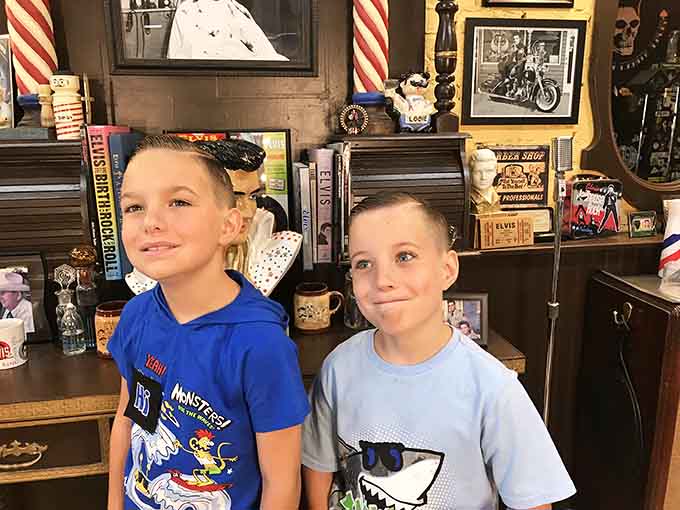 These young gentlemen are learning an important lesson: great haircuts and cool surroundings make perfect childhood memories.