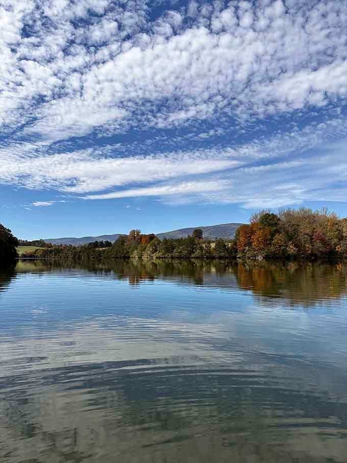 Cloud formations reflected in crystal-clear waters create abstract art that would make any gallery curator weep with envy.