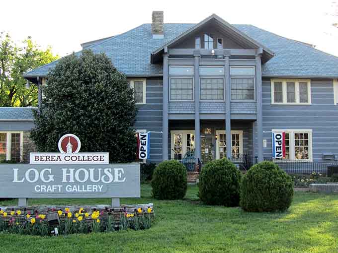 The Log House Craft Gallery welcomes visitors with spring blooms and treasures crafted by Appalachian artisans inside.