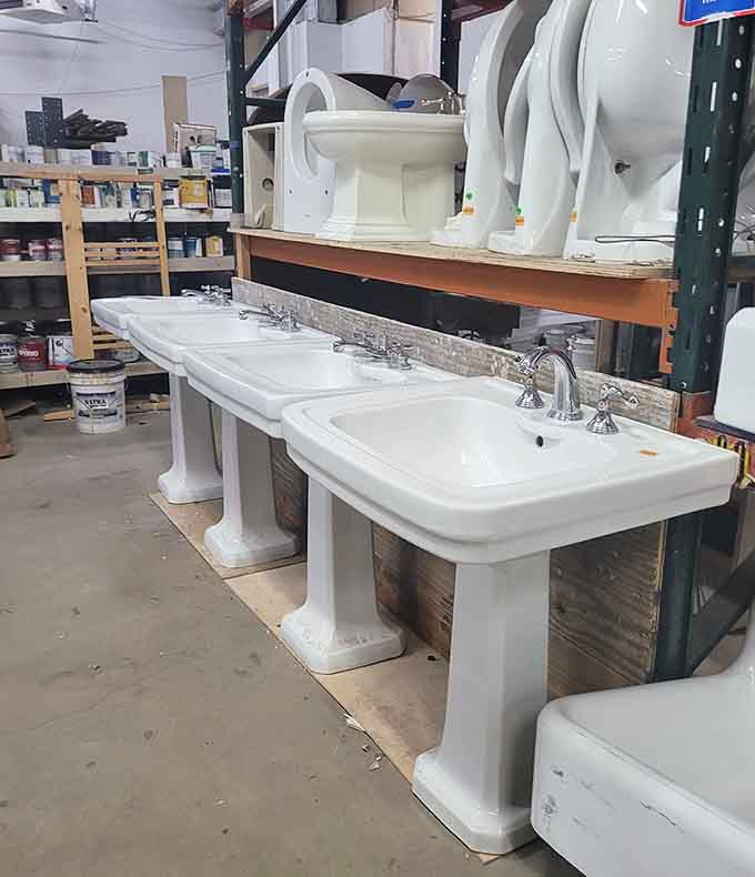 Pedestal sinks and toilets lined up like porcelain soldiers, ready to serve in their next bathroom assignment.
