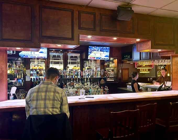 A well-stocked bar where the bartenders know their craft and the TVs know their place in the background.