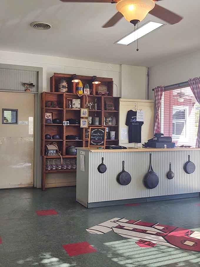 Cast iron skillets hanging like trophies tell you everything about this kitchen's commitment to doing things right.