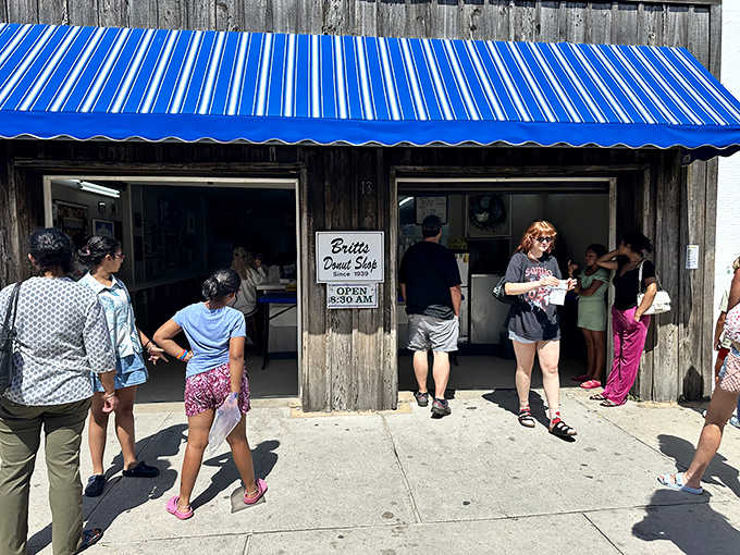 The classic boardwalk scene: people streaming out with their prizes, already planning their next visit before leaving.