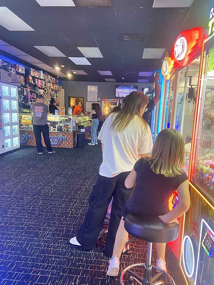 Families navigate the arcade floor together, proving that quality time doesn't require hiking boots or bug spray to be memorable.
