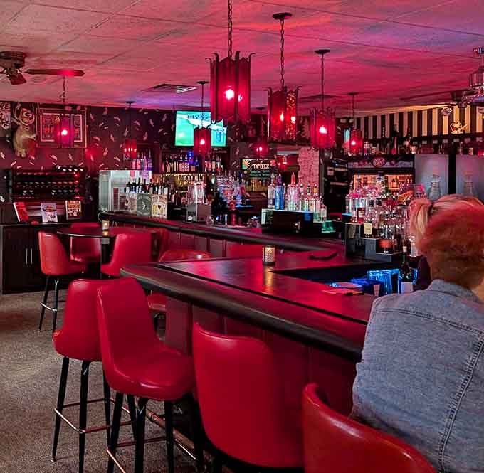 The bar glows with that inviting red ambiance, beckoning you to settle in for a cocktail or three.