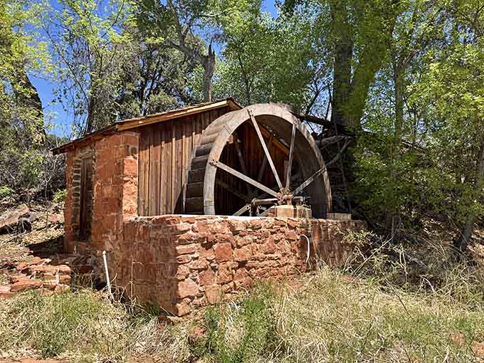 This weathered water wheel stands as a rustic reminder of the area's history, looking like a prop from Bonanza.