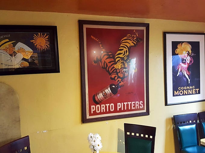 Vintage European advertising posters add worldly charm to walls that have witnessed countless perfect brunch moments over the years.