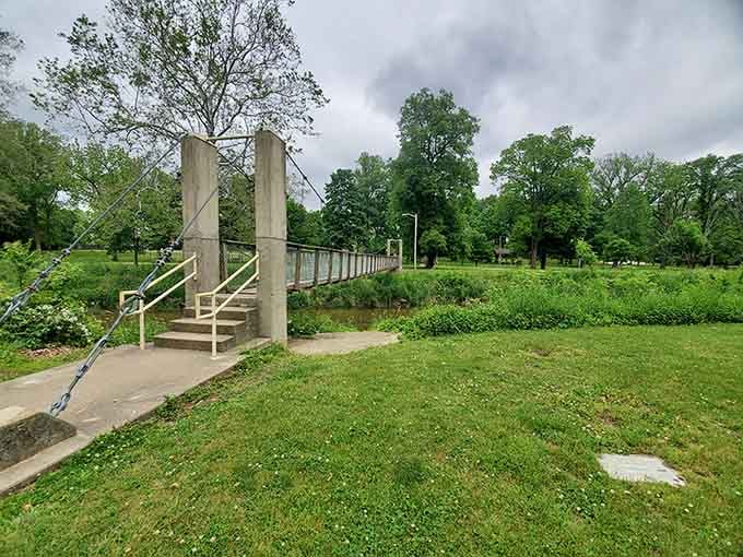 The suspension bridge stretches across peaceful waters, inviting leisurely strolls that your Fitbit will definitely appreciate and count.