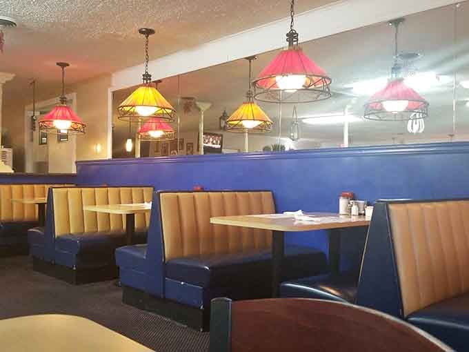 Booths in cheerful colors under pendant lights create the kind of atmosphere where strangers become breakfast buddies.