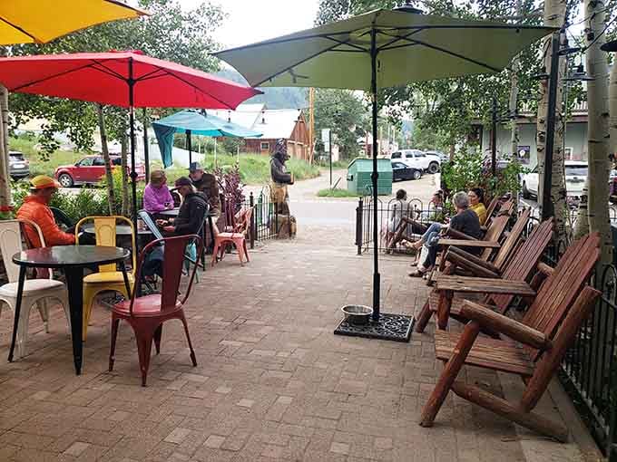 Colorful umbrellas and happy faces: this is what community looks like when it gathers for coffee.