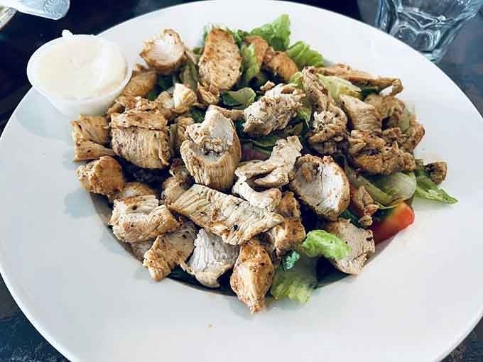 This Greek salad showcases grilled chicken atop crisp romaine with all the Mediterranean classics you'd hope to find.