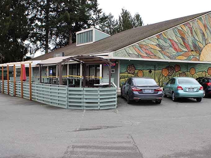 Colorful murals brighten the cafe exterior, proving small towns know how to make a statement without shouting.
