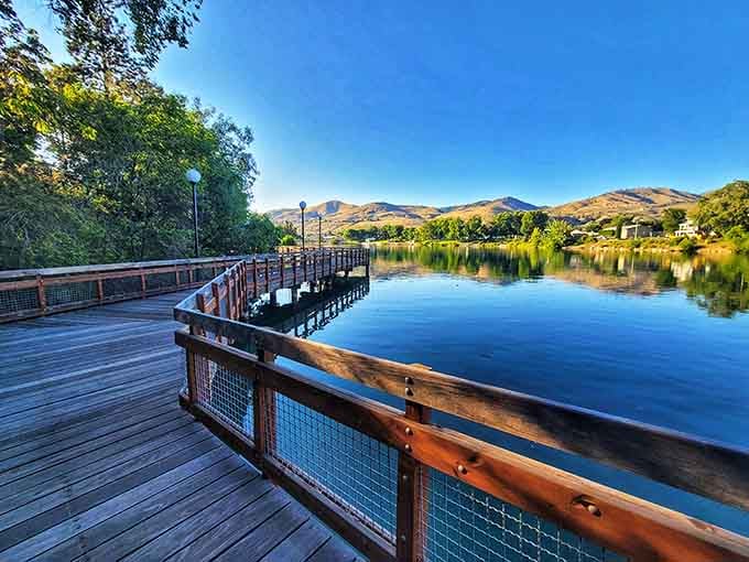 The Riverwalk's wooden boardwalk curves along mirror-calm waters, inviting leisurely strolls at any pace you choose.