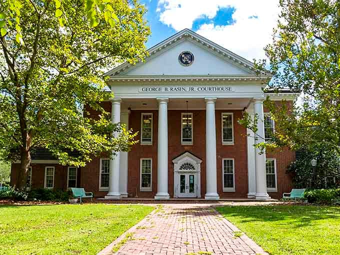The courthouse's stately columns and brick facade represent justice served with a side of architectural dignity.