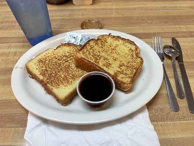 Thick-cut French toast with syrup waiting patiently proves breakfast doesn't need to be complicated to be perfect.