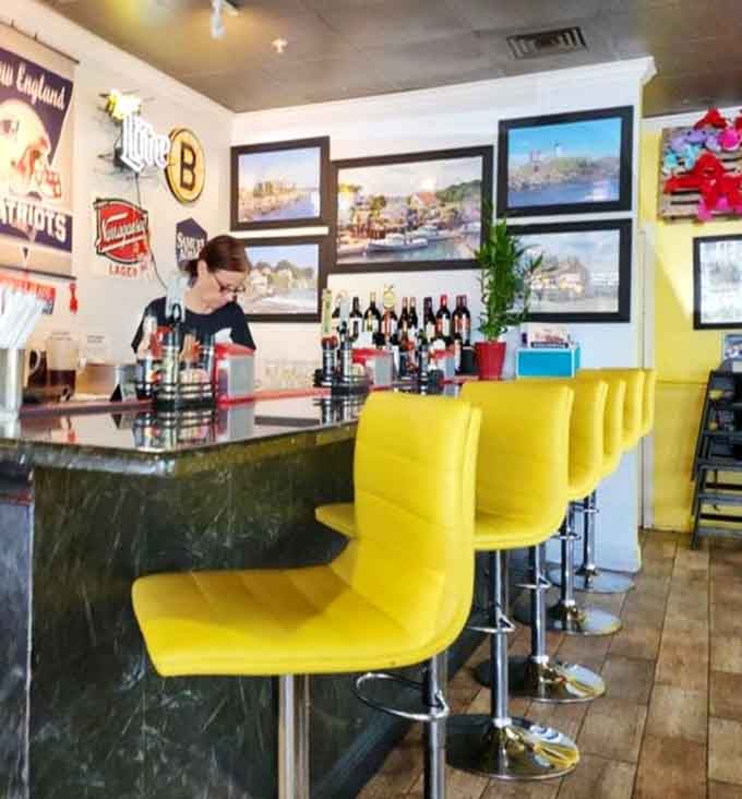 Bright yellow bar stools lined up like sunshine, waiting for someone to sit down and order something delicious and oceanic.