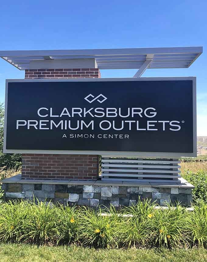 The entrance sign stands proud like a beacon of savings, welcoming deal-seekers to their happy place with open arms.