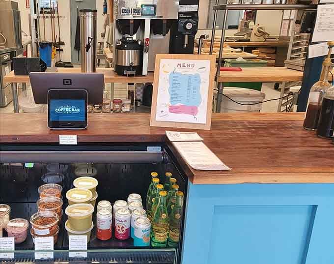The counter where magic happens: fresh spreads, coffee brewing, and decisions you'll happily make daily.