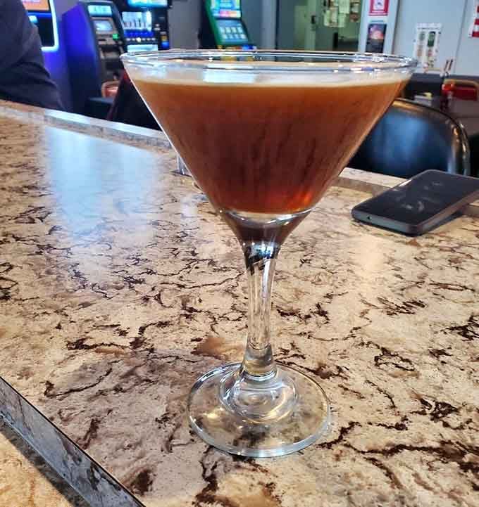 Silky espresso martini in classic stemware brings sophisticated cocktail culture to this welcoming neighborhood gathering spot with flair.
