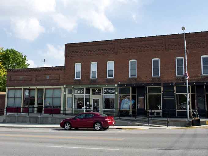Historic storefronts along Main Street maintain their dignity even as the world rushes past at highway speeds.