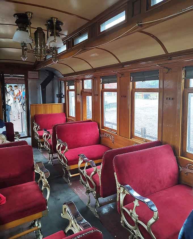 Plush red seating in ornate parlor cars reminds us that travel was once truly an elegant affair.