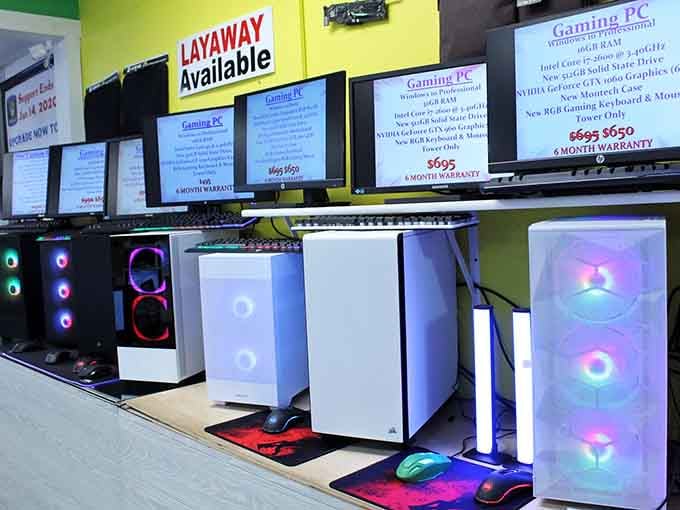 Gaming PCs glow with rainbow lights, offering layaway plans that make high-tech dreams accessible to budget-conscious shoppers.