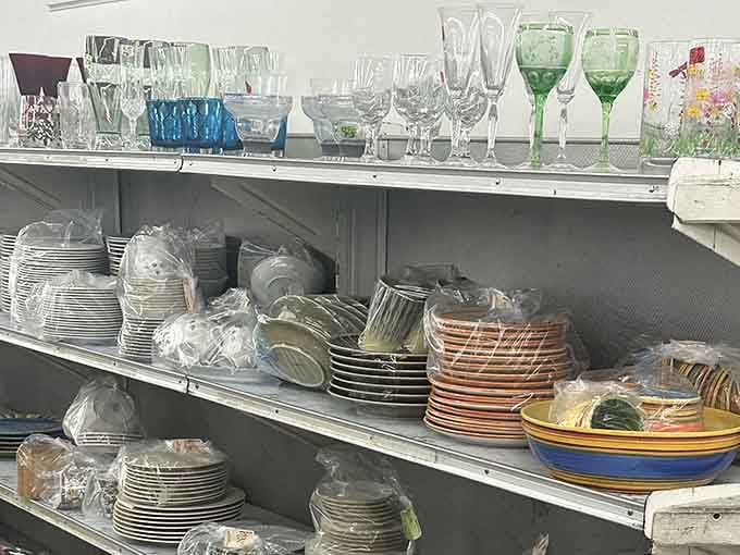 Crystal stemware and colorful dishes stack up ready to host your next dinner party with vintage flair.