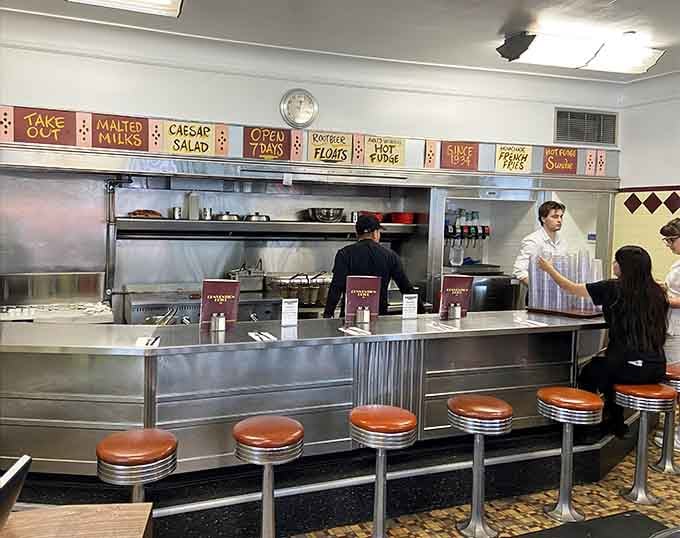 Counter seating offers front-row tickets to the culinary show, where griddles sizzle and burgers reach their destiny.