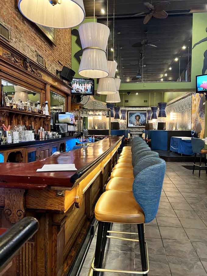 The bar gleams with polished wood and promises, stocked with enough bourbon to satisfy any Southern gentleman or lady.