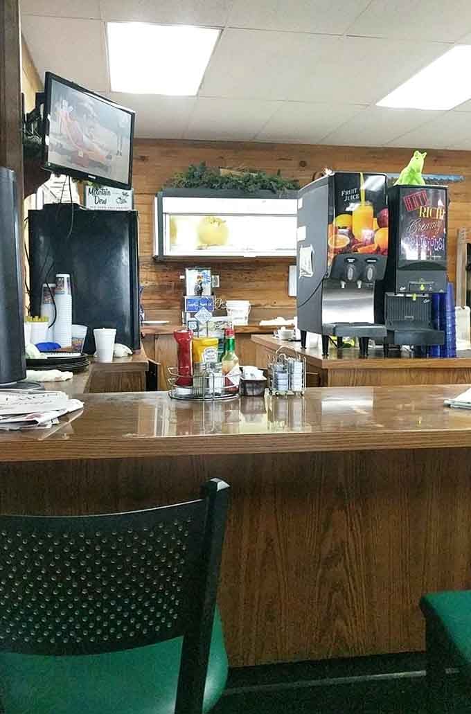 Counter seating where coffee refills appear like magic and the view includes all the breakfast action.