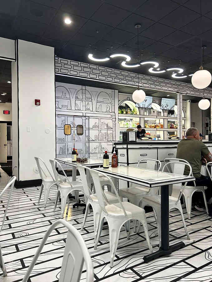 The friendly staff navigating this sketched landscape like they haven't completely lost their minds working here daily.