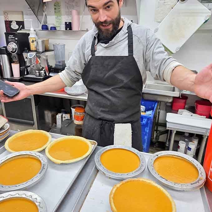 The talented folks behind the magic, surrounded by fresh pies and the tools of their delicious trade.