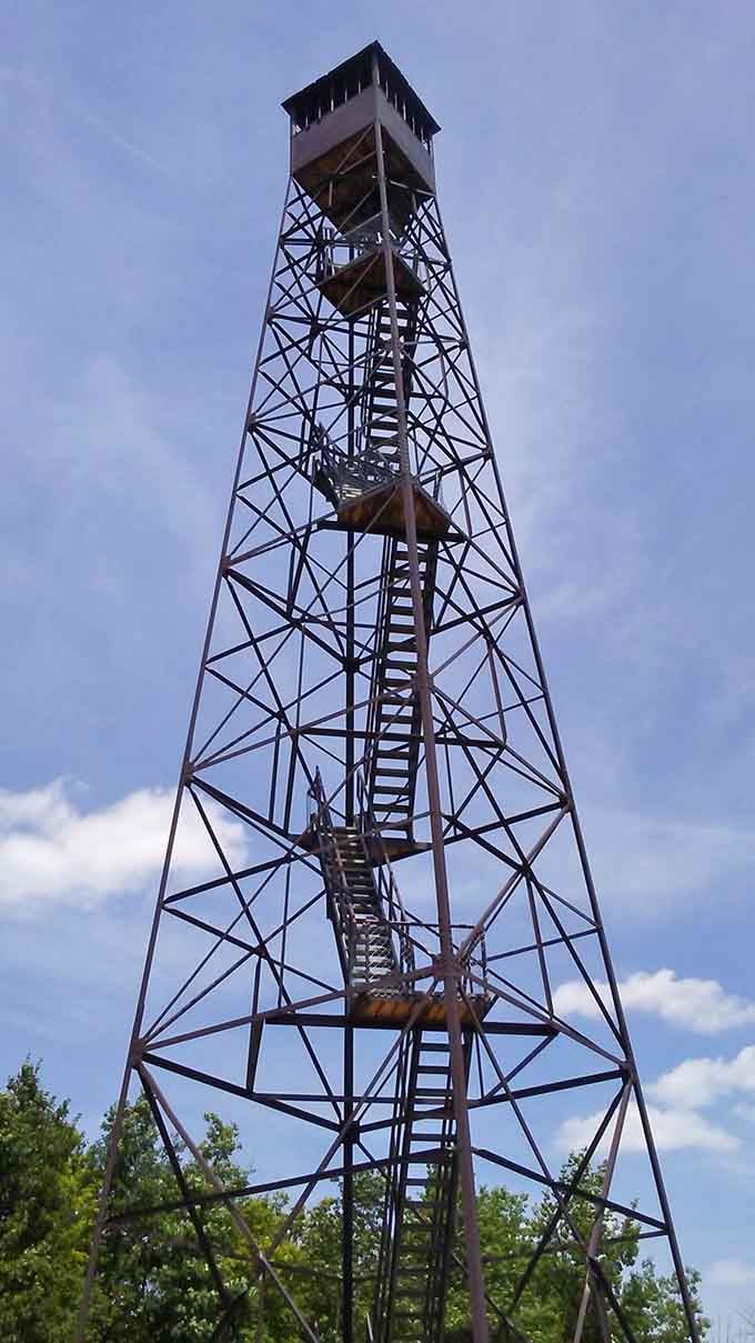 The fire tower reaches skyward, offering views that'll make you forget you're afraid of heights for a minute.