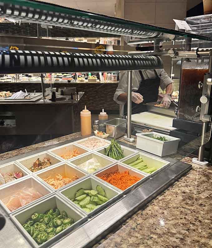 Fresh vegetables at the sushi station prove someone here actually cares about balanced nutrition and colorful presentations.