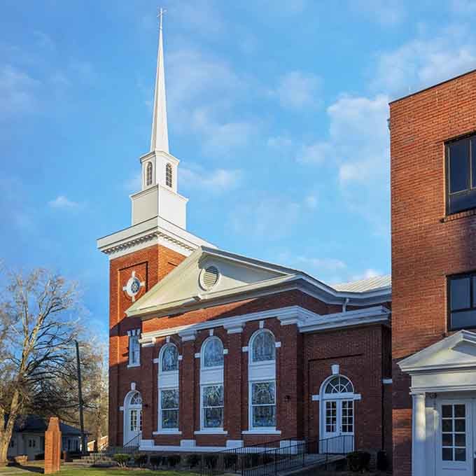 That steeple reaches skyward like it's trying to touch the clouds, anchoring the spiritual heart of downtown.