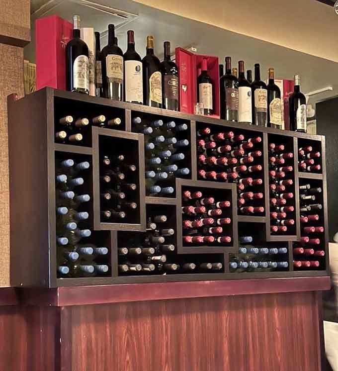 That wine display isn't just storage; it's a carefully curated collection waiting to meet your steak.