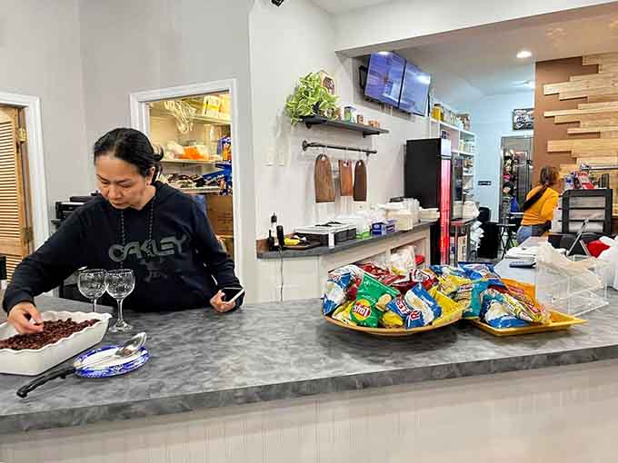 The friendly staff behind the counter ready to guide you through menu choices with genuine warmth and helpful recommendations.