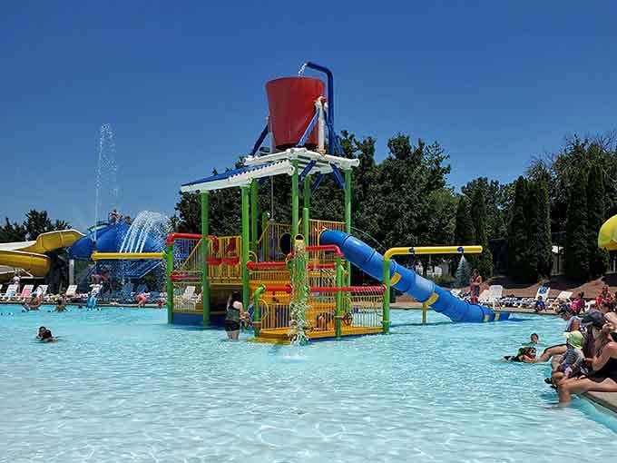 This rainbow explosion of slides and water features looks like a Crayola box came to life and decided to party.