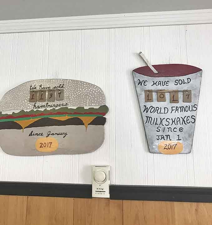 These cheerful signs track the impressive number of burgers and shakes served to grateful desert wanderers.