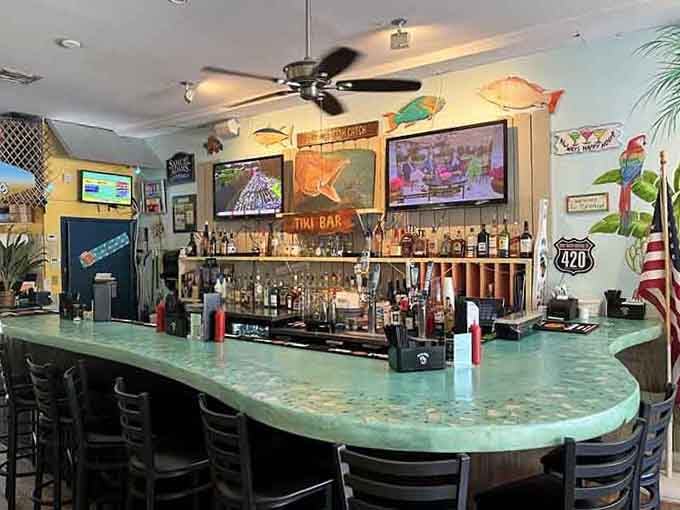 The tiki bar area where tropical dreams meet cold beverages and good times in the best possible way.