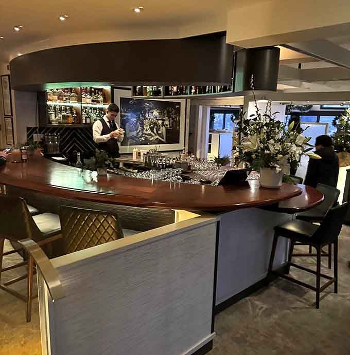 The bar where skilled hands craft liquid art while you contemplate life's important decisions, like another round.