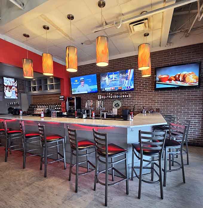 The bar area where you can watch sports, sip drinks, and contemplate ordering another burger because life is short.