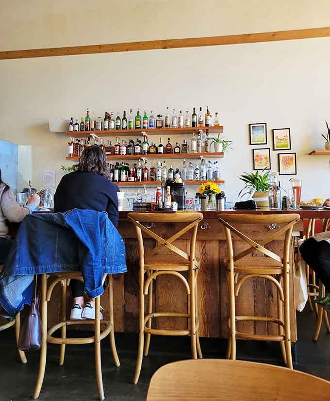 The bar area where liquid courage meets weekend relaxation, stocked better than most people's home liquor cabinets.
