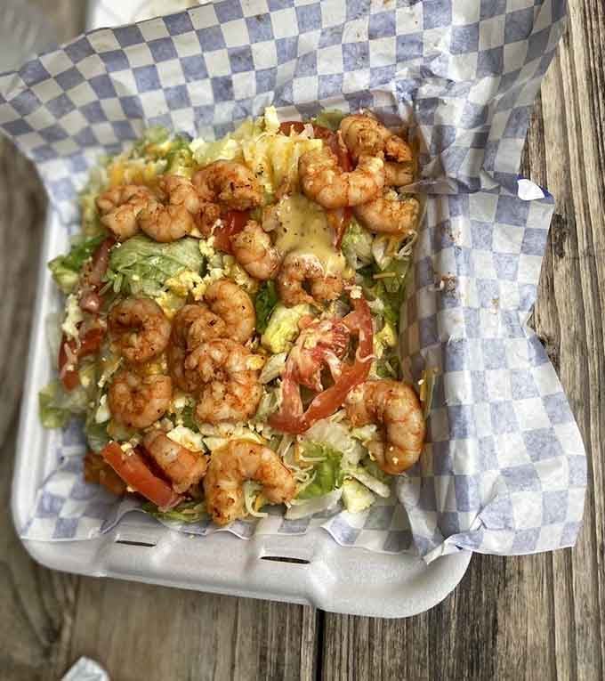 Grilled shrimp over fresh salad proves that eating healthy doesn't mean sacrificing flavor or fun at the table.