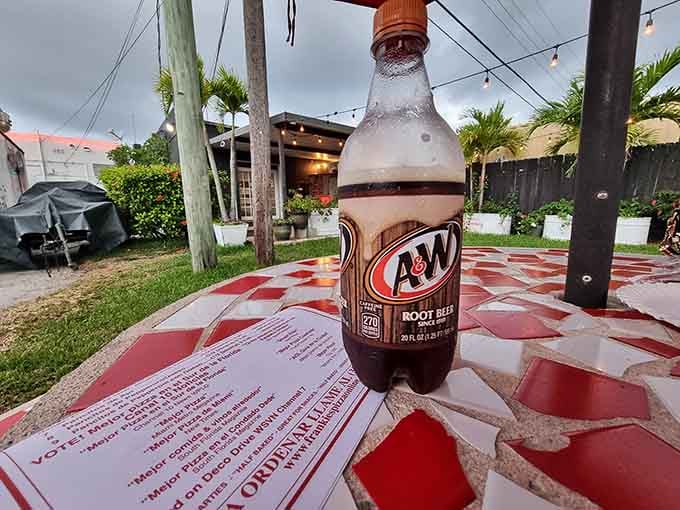 Ice-cold root beer on a checkered table, the classic American combo that never disappoints or goes wrong.