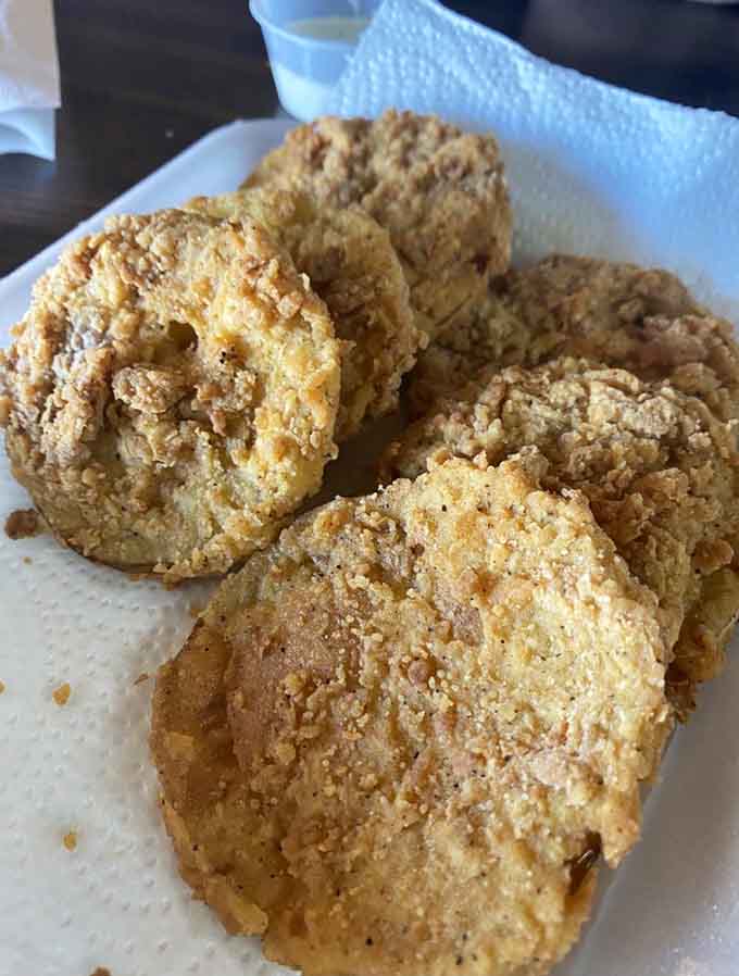 Fried squash in a basket lined with paper towels, because sometimes simple presentation is all perfection needs to shine.