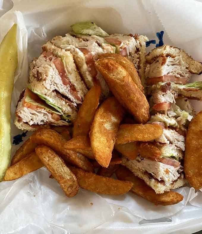 That turkey club sandwich is stacked higher than your weekend plans and twice as satisfying to dive into.